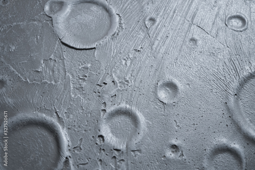 Decorative plaster lunar surface imitation. Close-up of rough stone ...