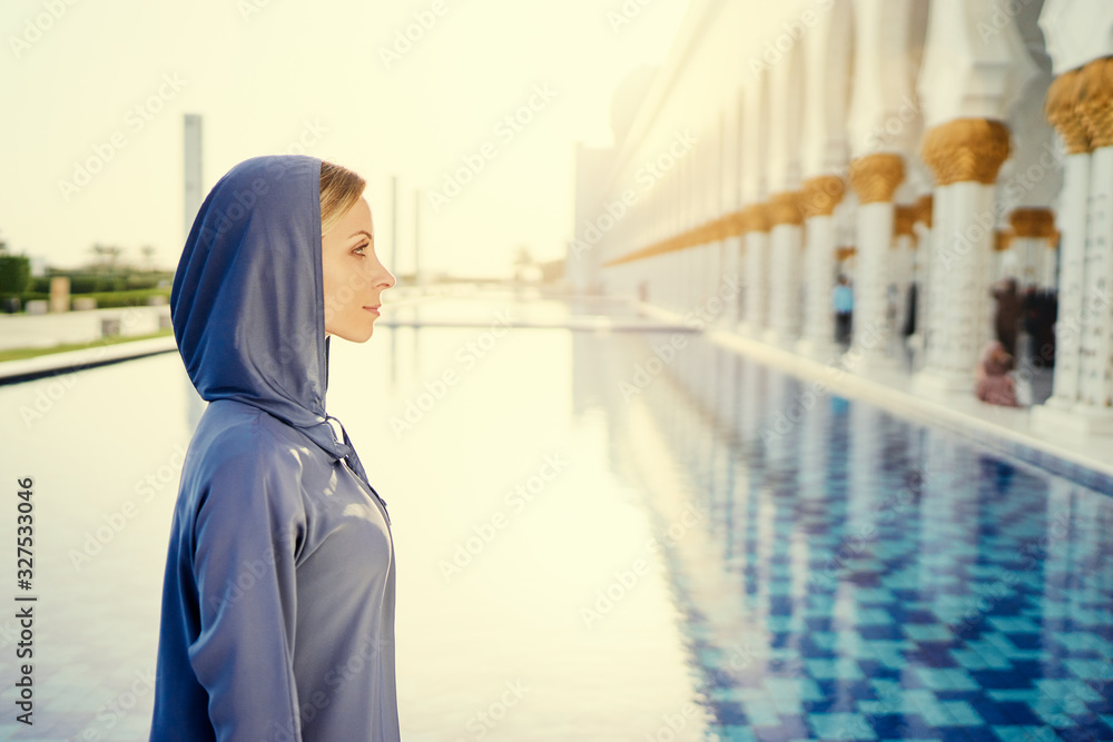 Traveling by Unated Arabic Emirates. Woman in traditional abaya ...