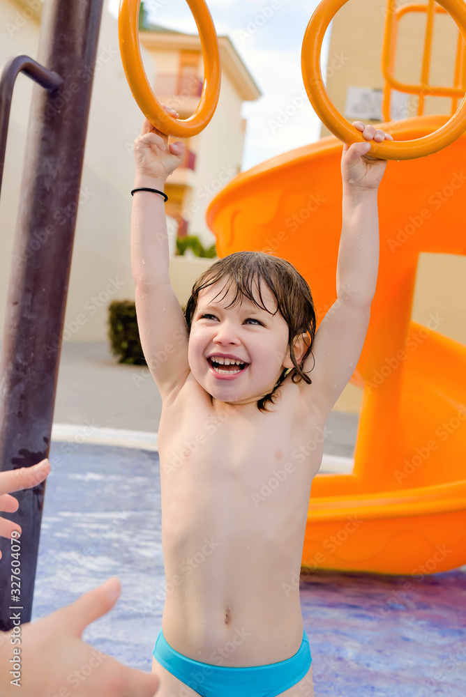 cute little girl playing in the pool Stock Photo | Adobe Stock