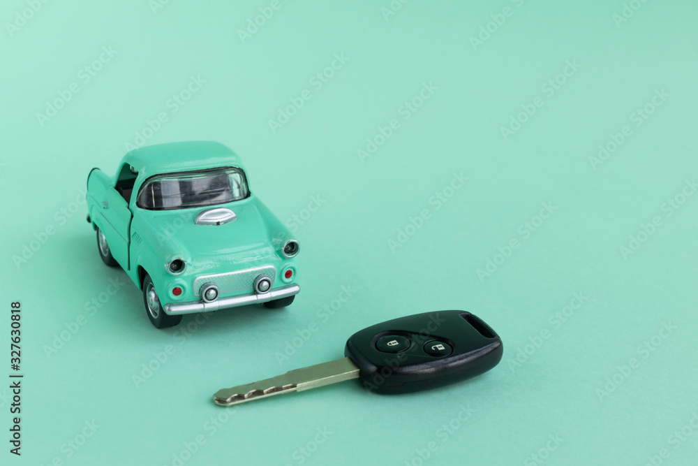 Toy car with key on a menthol background Stock Photo | Adobe Stock