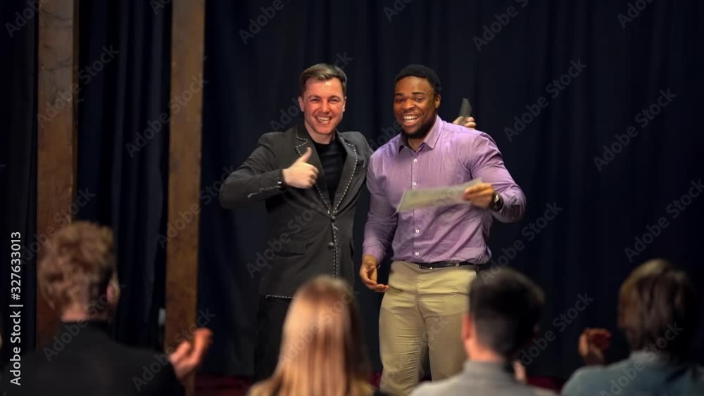 awarding a diploma and certificate on stage by a young black guy Stock ...