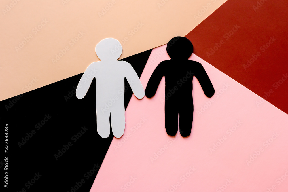 Black and white cardboard silhouettes on a colored background. concept ...