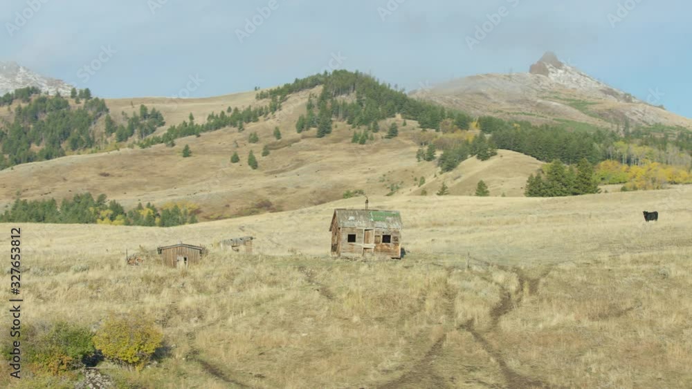 An abandoned mountain cabin sits in the foothills of the Gallatin ...