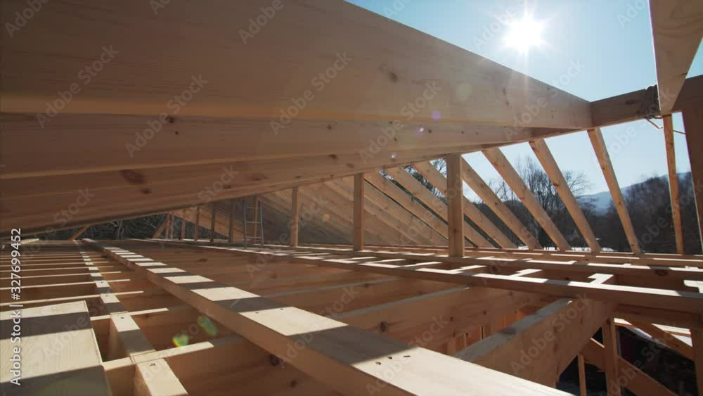 View of the area under roof beams, future attic of the frame house ...
