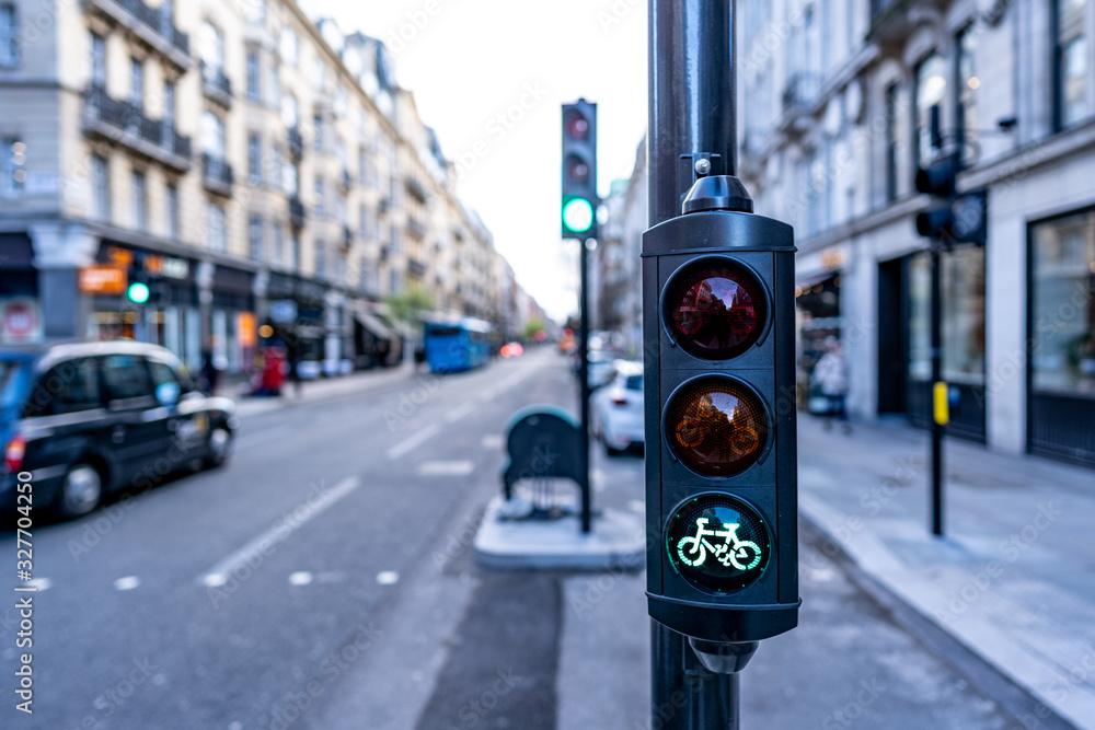 green cycle traffic light in the city of London Stock Photo | Adobe Stock