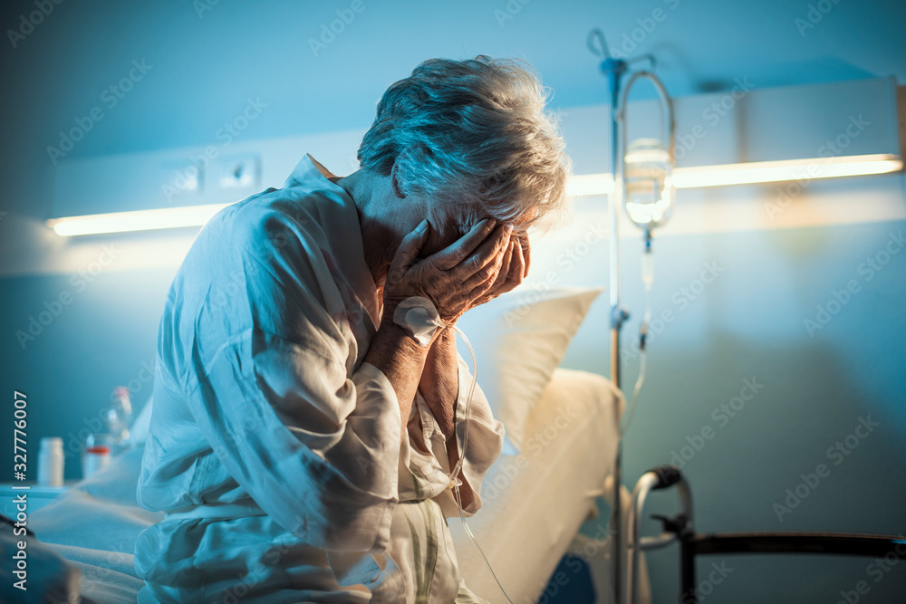 Lonely senior patient crying at the hospital Stock Photo | Adobe Stock