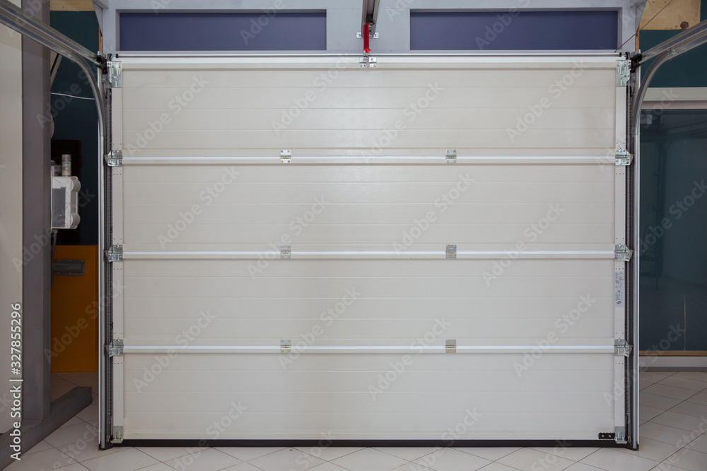 Shutter door or roller door and concrete floor outside .White Automatic ...