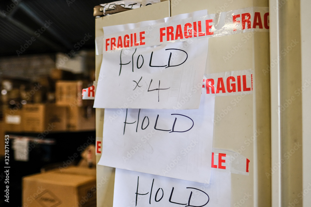 Fragile packaging tape seen on a large card board box, seen prior to ...