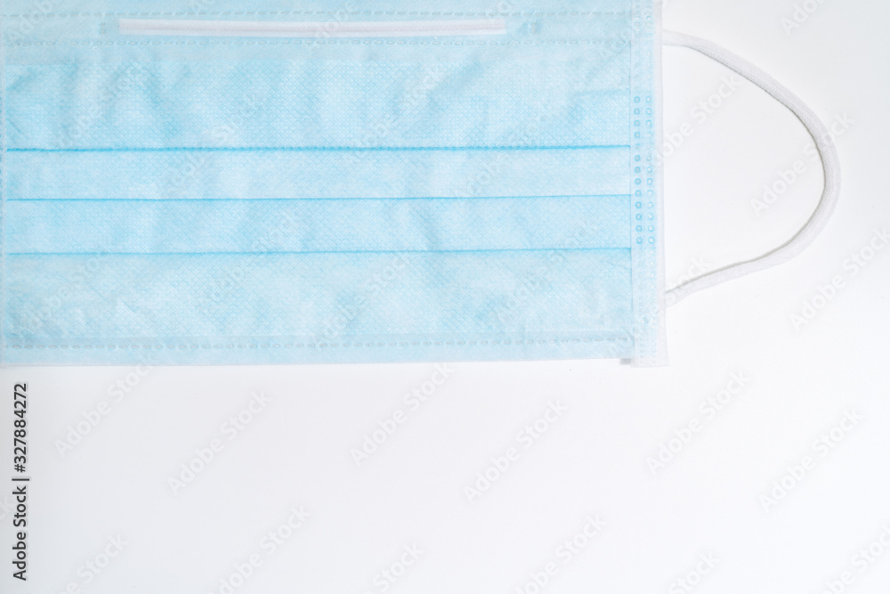 Surgical mask with rubber ear straps. Typical 3-ply surgical mask to ...