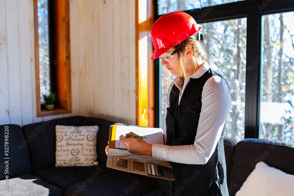 caucasian woman inspector during pre-purchase inspection, she wearing a ...