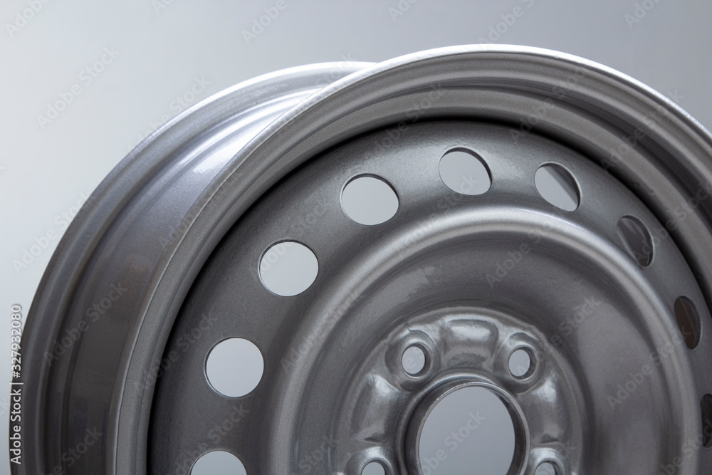 part of Steel wheel rim on grey background Stock Photo | Adobe Stock