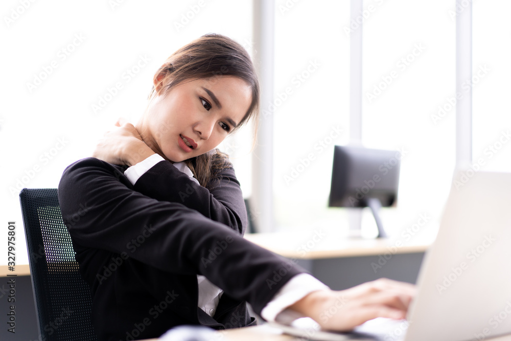 Young beautiful business woman having an office syndrome problem after ...