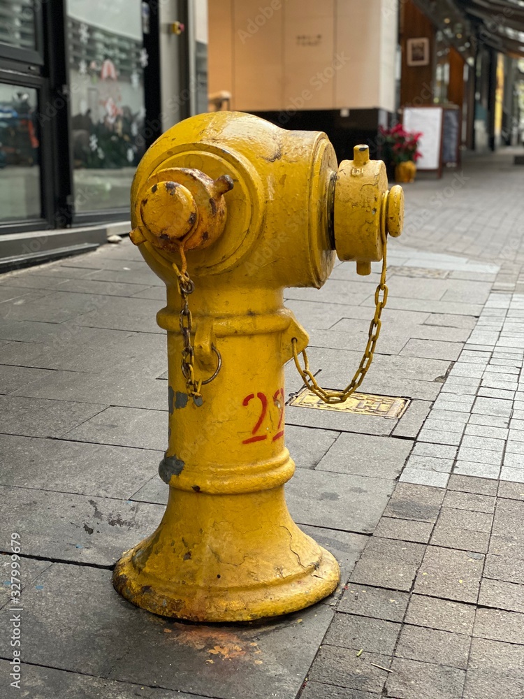 yellow fire hydrant in hong kong Stock Photo | Adobe Stock
