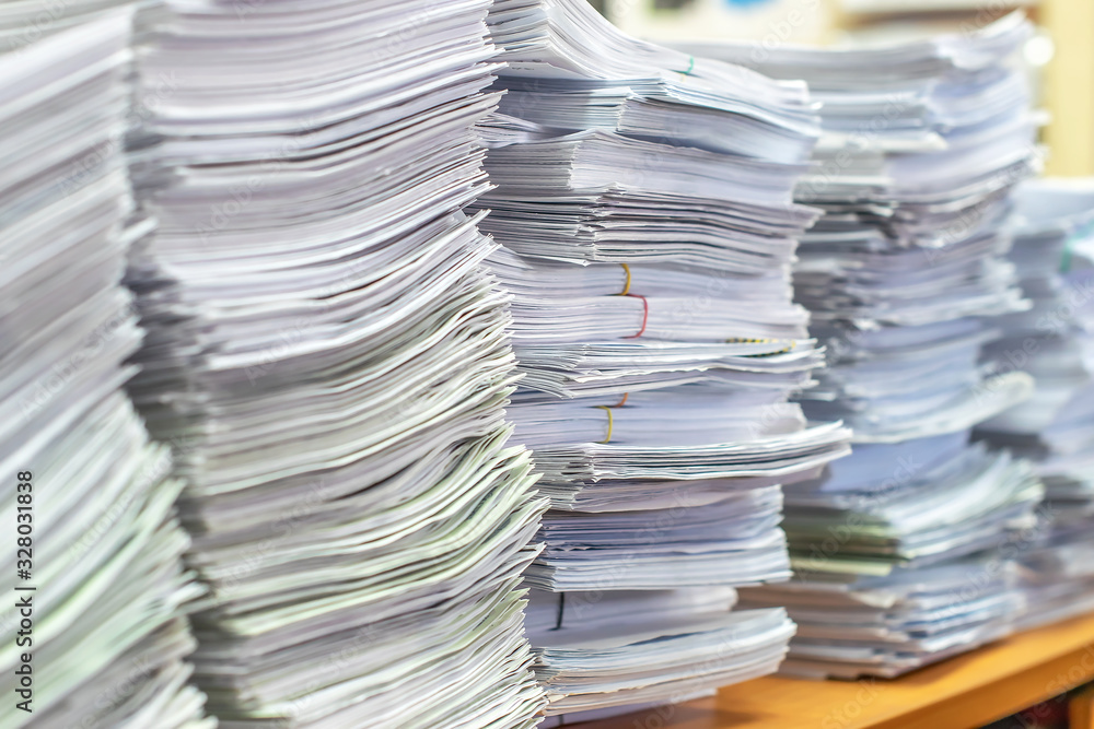 bundles bales of paper documents. stacks packs pile on the desk in the ...