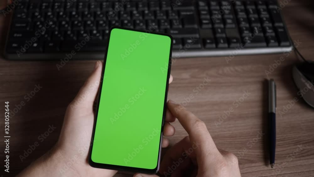 Man Scanning Fingerprint on smartphone with Green Mock-up Screen, Doing ...