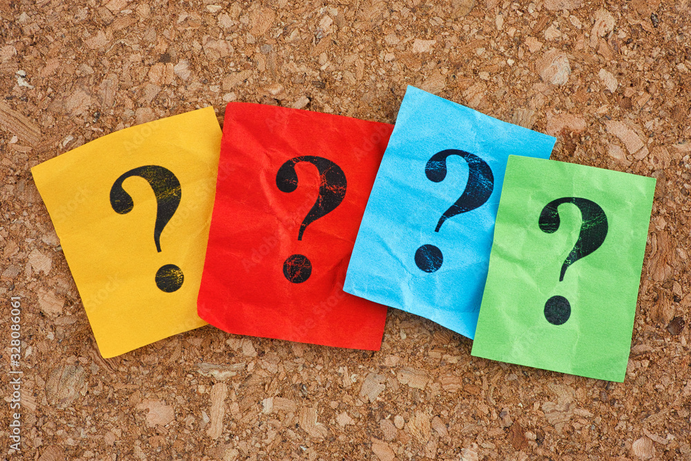Colorful paper notes with question marks on a cork board Stock Photo ...