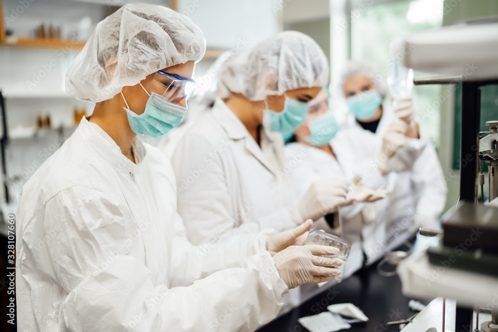 Team of pharmacists developing parenteral antibody antivirus ...