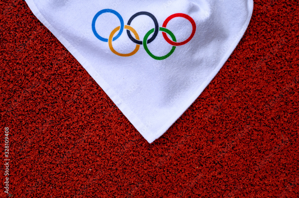 TOKYO, JAPAN, MARCH 5. 2020: Olympic rings on red athletics track ...