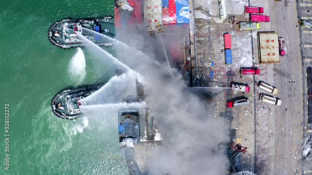 A burning fire boat Products Fire fighter during cargo fire accident at ...