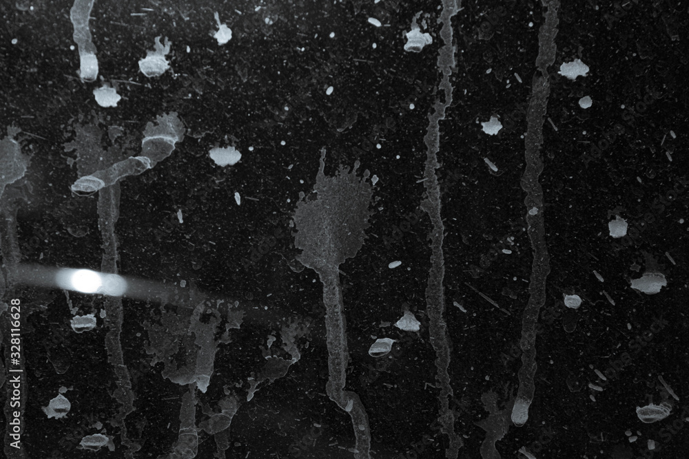 Drops and smudges of dirt on the glass are black. Background, texture ...