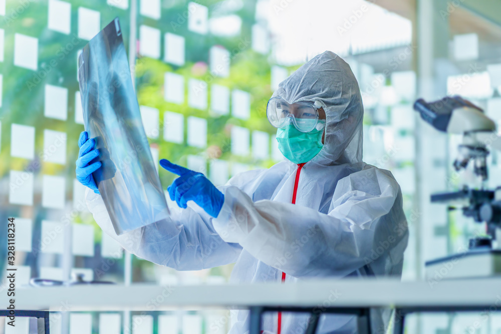 Scientist, Microbiologist or Doctor checking examining viral infection ...