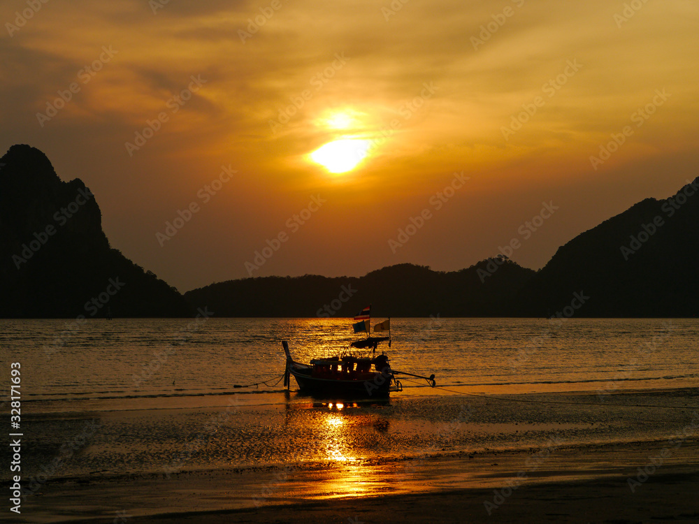 Sensational golden sunset over the beautiful Pak Meng beach with a ...