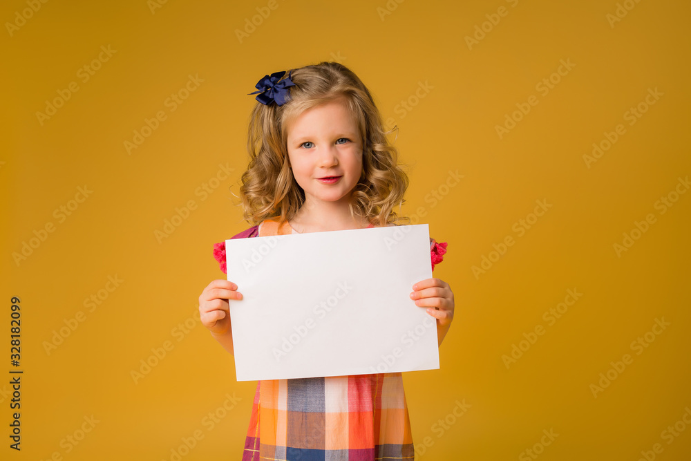 baby girl holding white sheet.Cute little girl with white sheet of ...