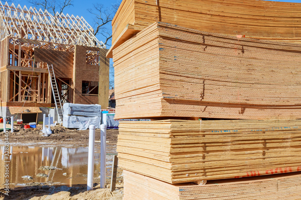 Stacked wooden building materials a stack of boards wood frame and beam ...