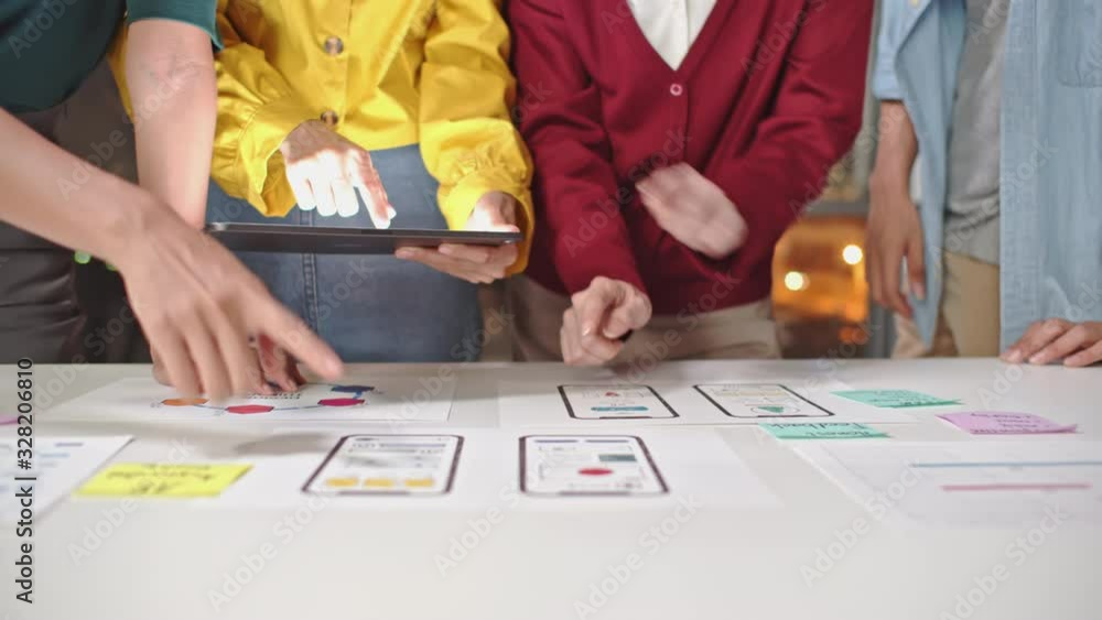 Young Asian business creative developer team work together at night ...