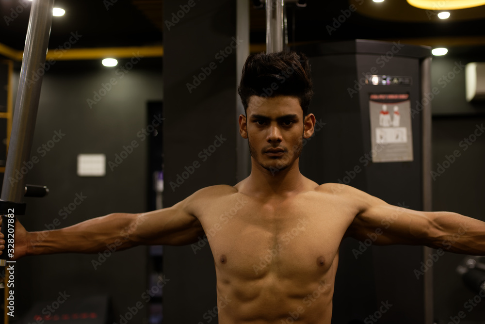 An young and handsome Indian Bengali brunette man with muscular body ...