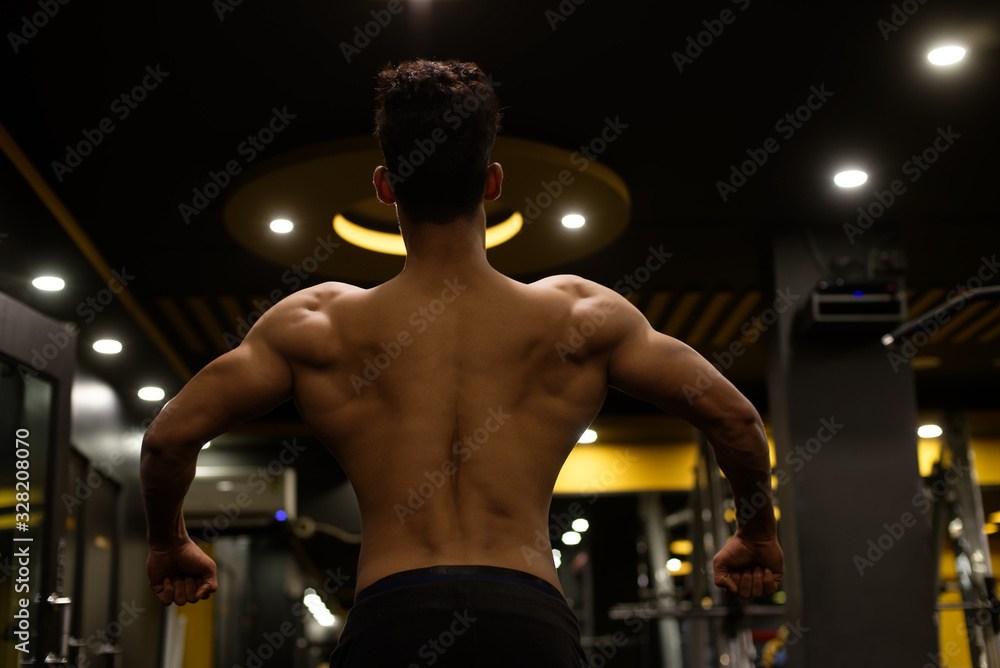 An young and handsome Indian Bengali brunette man with muscular body ...