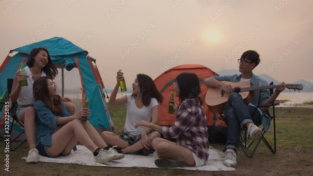 Slow motion normal shot : Group of asian teenager friend funny, enjoy and drinking beer at ...