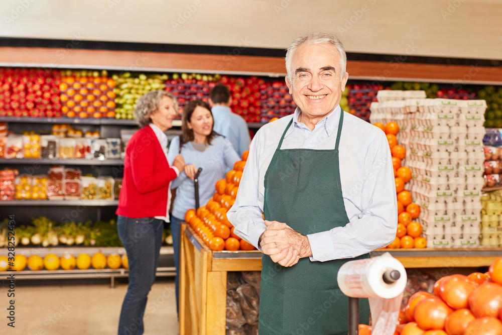 Senior man as a salesman or market manager Stock Photo | Adobe Stock