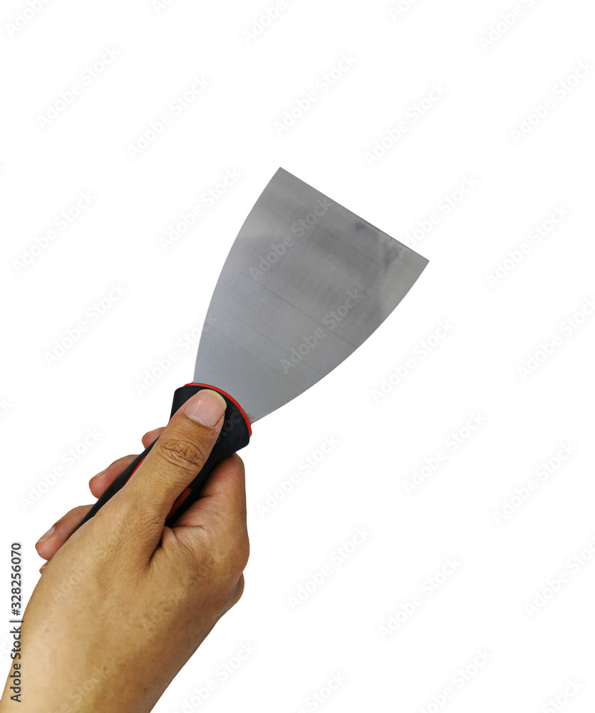 Hand holding a metallic putty knife on white background. A new putty ...