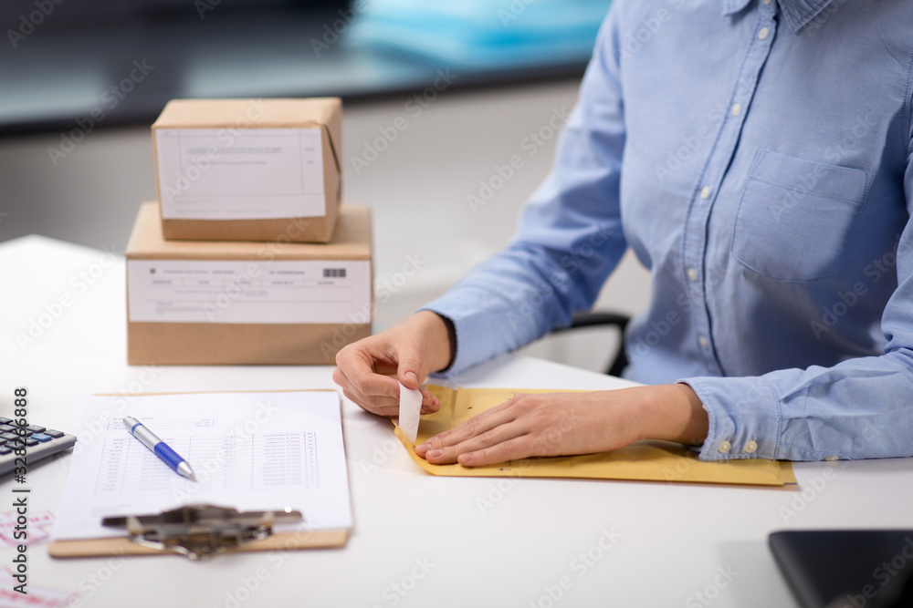 delivery, mail service, people and shipment concept - close up of woman ...