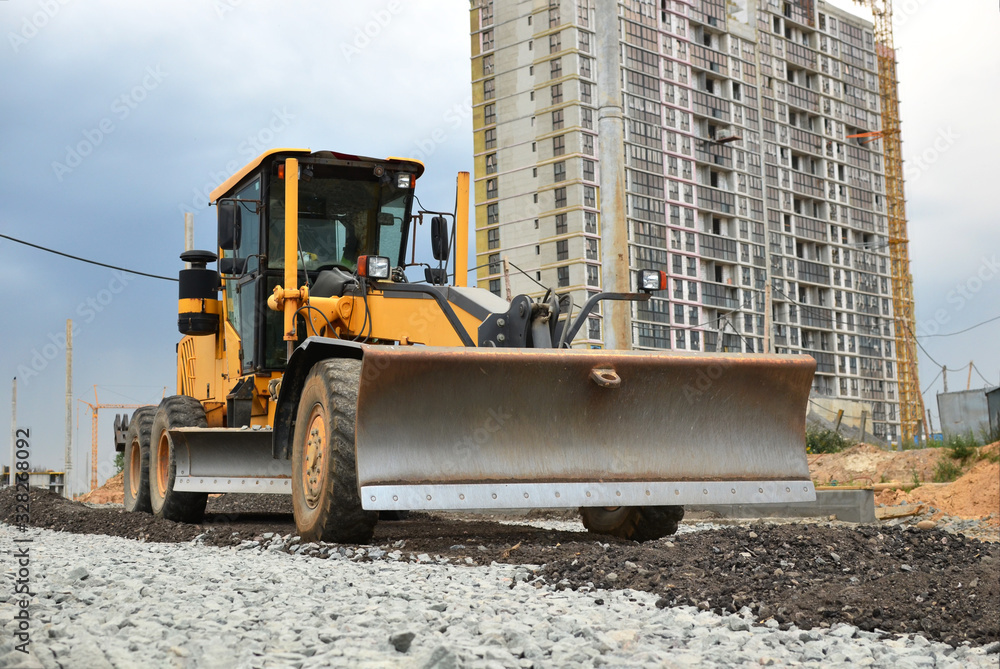 Сonstruction machine Motor Grader at a construction site level the ...