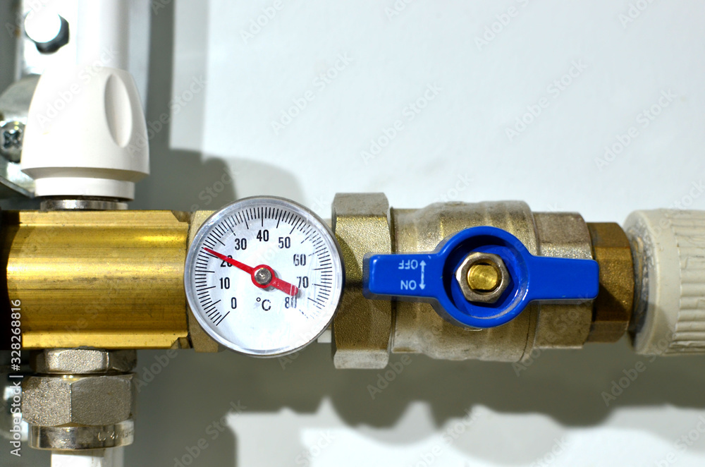 Close up of manometer, pipe, flow meter, water pumps and valves of ...