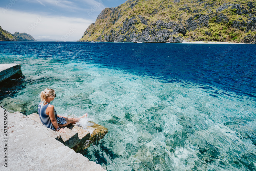 El Nido, Palawan, Philippines. Tourist female on Matinloc dock pier ...