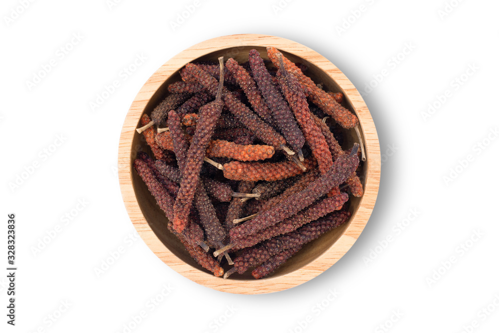 Dry Idian long pepper or Piper longum in wooden bowl isolated on white ...