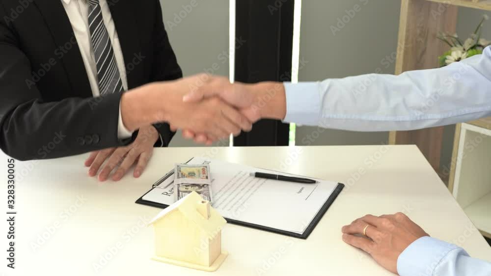 .4k video of Real Estate developer Agent and sign on document giving ...