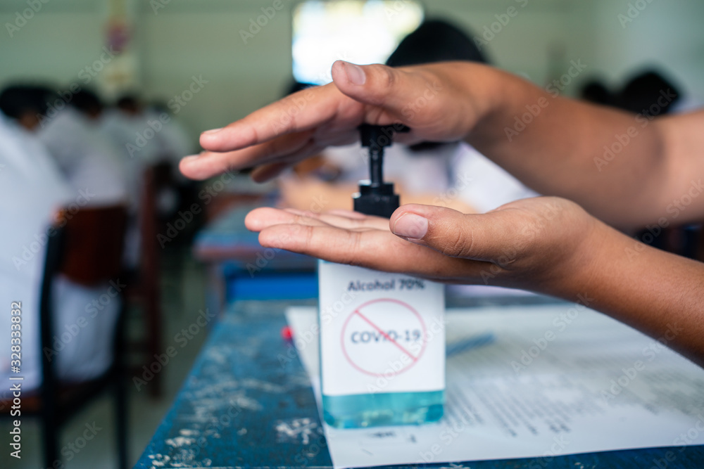 Students washing hand with Alcohol 70% Sanitizer for protect corona ...