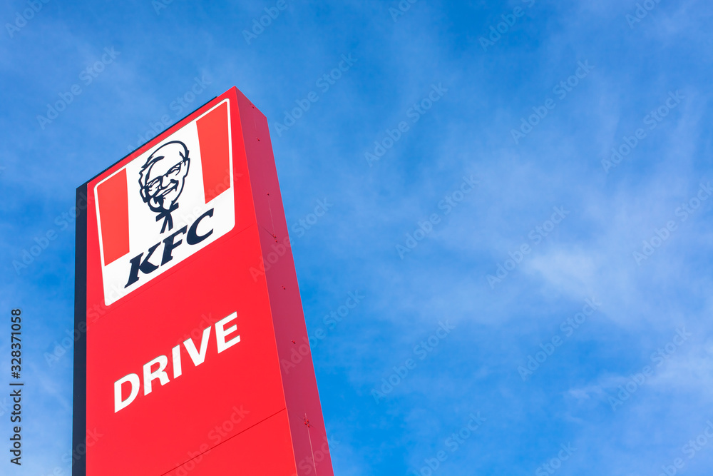 KFC fast food restaurant logo at its building Stock Photo | Adobe Stock