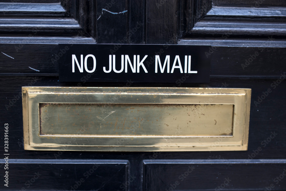 House letterbox with 'No junk mail' sign and junk mail Stock Photo ...