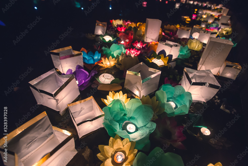 Beautiful Multicolored floating lanterns in the water in chinese or ...