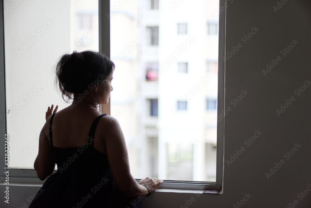 Backside portrait of a beautiful Indian Bengali brunette woman wearing ...