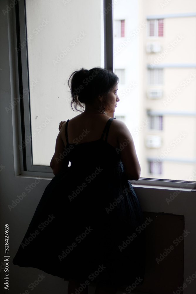 Backside portrait of a beautiful Indian Bengali brunette woman wearing ...