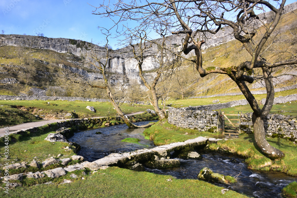 Malham Beck and the Old Stone Clapper Bridge at Malham Cove Stock Photo ...