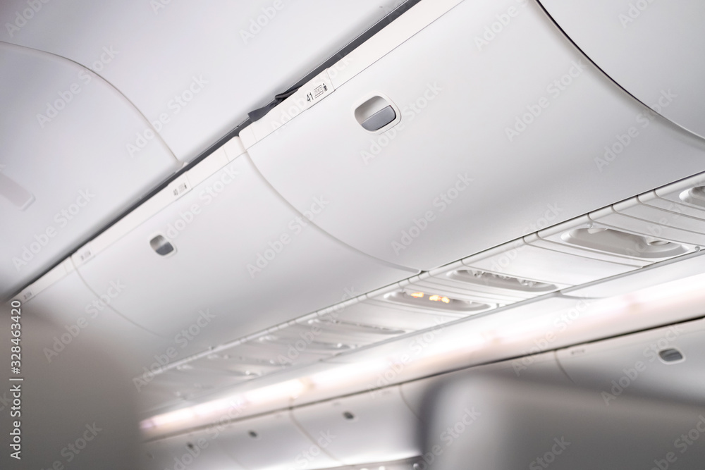 Commercial aircraft interior in airplane cabin, Overhead compartment ...