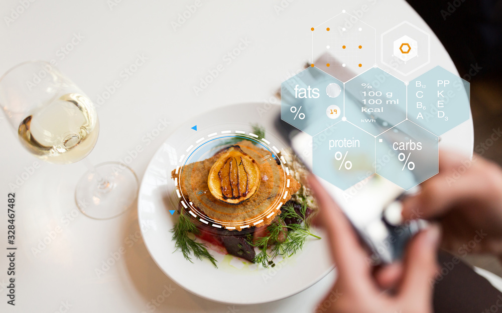 food, technology, eating and people concept - woman with smartphone ...