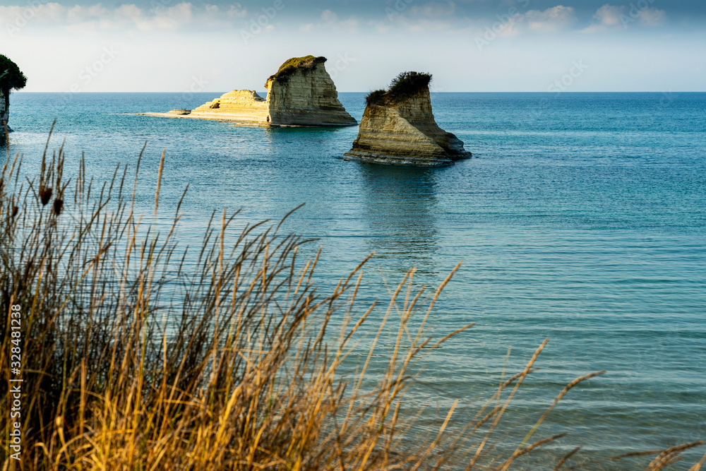 Hypnotic sea view from above with beautiful rocks like dinosaurs in ...